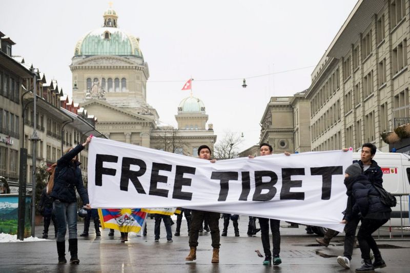 Tibet activists arrested in Switzerland protest during Xi visit - BBC News