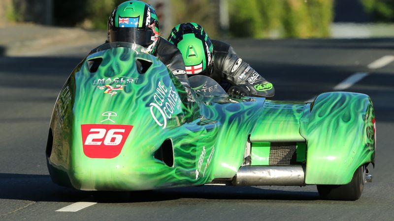 Isle of Man TT racer 'thrown off sidecar' in death crash - BBC News
