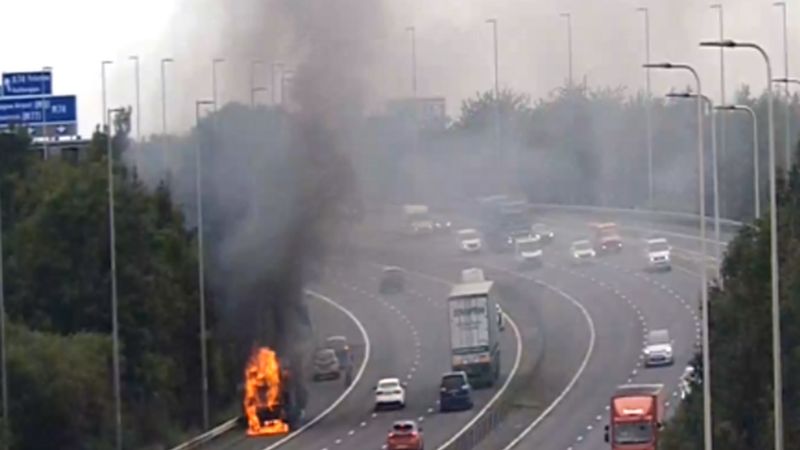 Bus fire forces partial closure of M74 motorway near Glasgow - BBC News