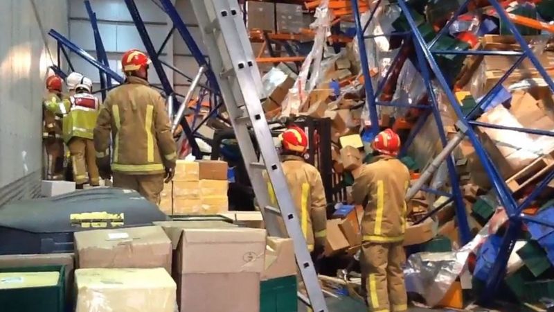 'Trapped by cheese' worker freed after warehouse collapse - BBC News