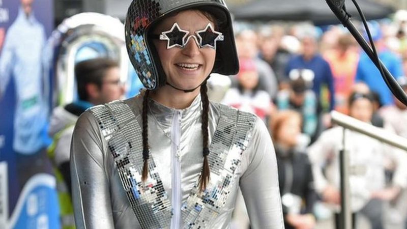 'Disco ball' runner completes year-long challenge in Solihull - BBC News