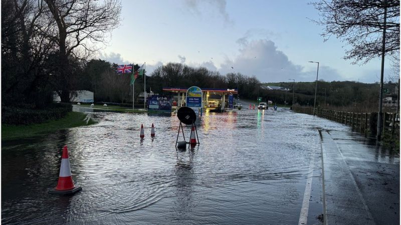 Wales weather: Family at flood-hit caravan site in tractor rescue - BBC ...