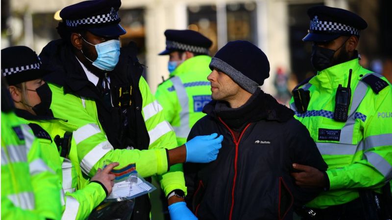 Police arrest 16 at Clapham Common anti-lockdown protest - BBC News