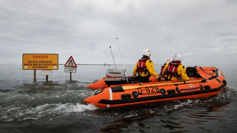 Holy Island: Six people and dog rescued by lifeboat from causeway - BBC ...