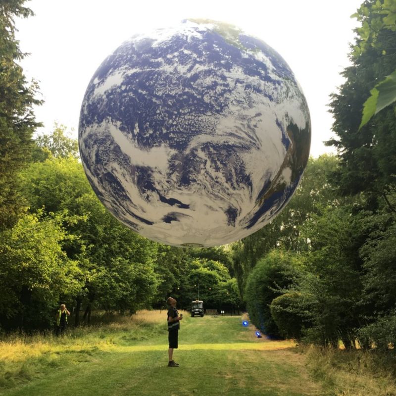 Moon artist Luke Jerram unveils giant Earth sculpture - BBC News