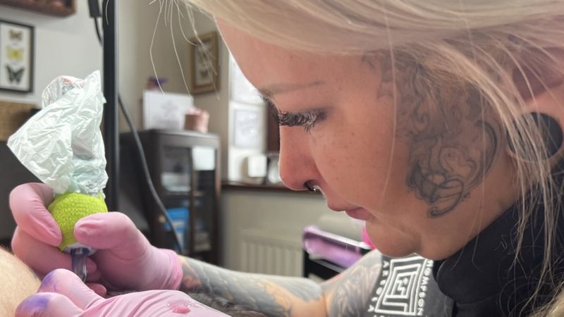 Bradford tattooist covering up scars to help heal trauma - BBC News