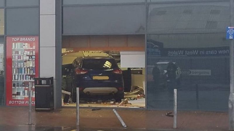 Car crashes through Home Bargains window in Cross Hands - BBC News