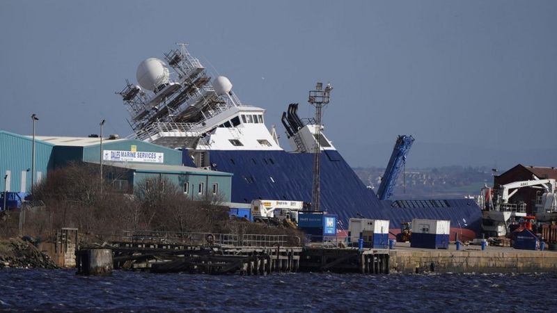 Multiple injuries after ship tips over at Edinburgh dockyard - BBC News