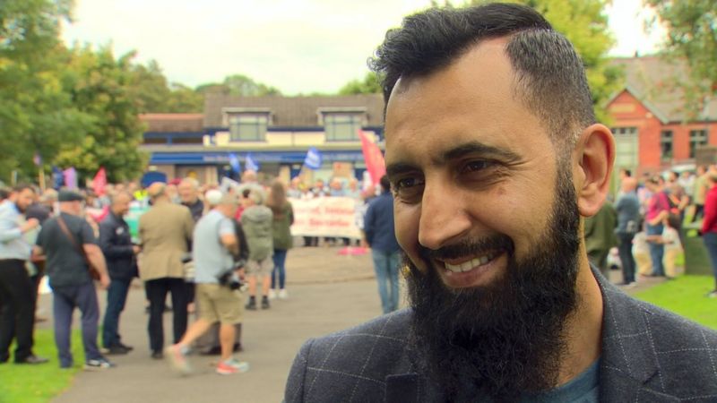 Dunmurry: Anti-racism rally after Nazi flags flown near mosque - BBC News