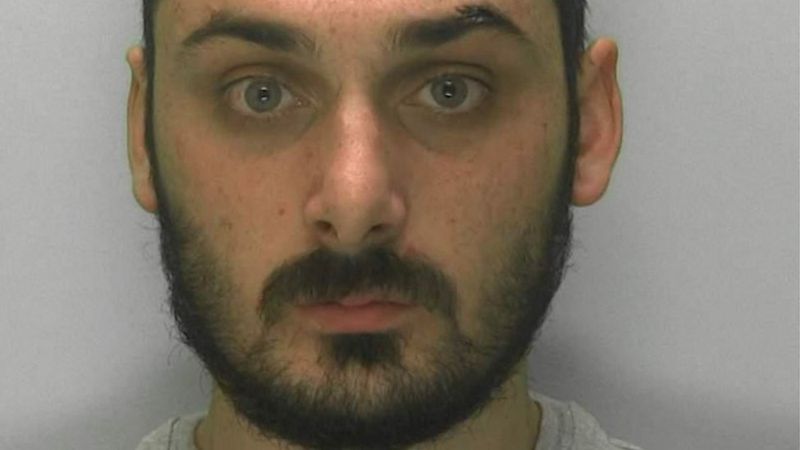 Prisoner still at large after mistaken release - BBC News