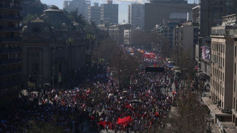 Chileans protest against Pinochet-era private pension scheme - BBC News