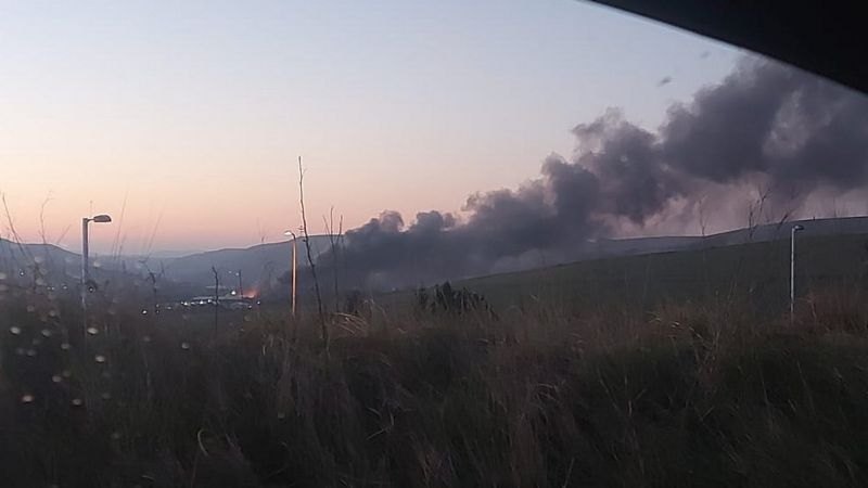 Fire crews tackle blaze at Rhymney recycling factory - BBC News