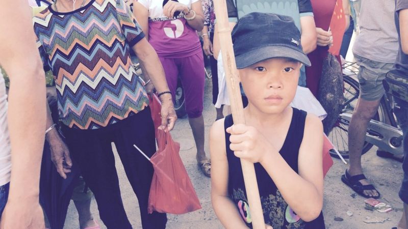 Wukan's 'rebel' villagers take to streets in ongoing protest - BBC News