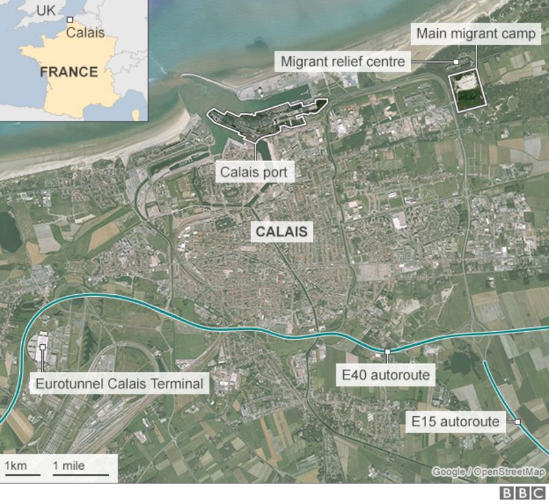 Dozens of Calais migrants try to storm Channel Tunnel - BBC News