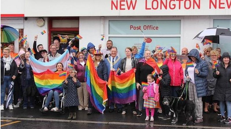 New Longton villagers rally against Pride flag hate mail - BBC News