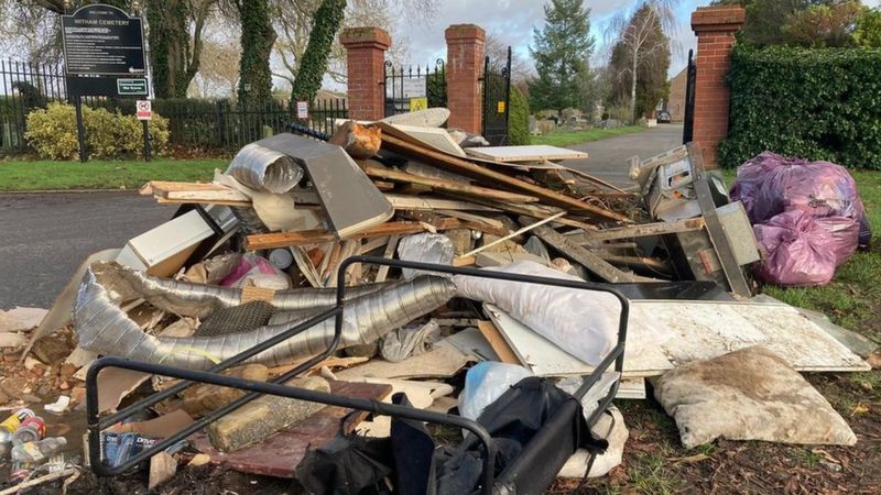 Pitsea Cemetery entrance blocked by fly-tipped green waste - BBC News