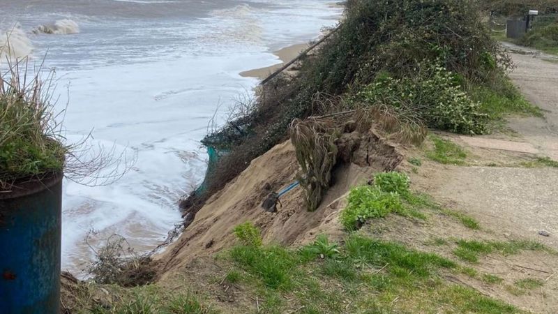 Hemsby road partially collapses on erosion-hit coastline - BBC News