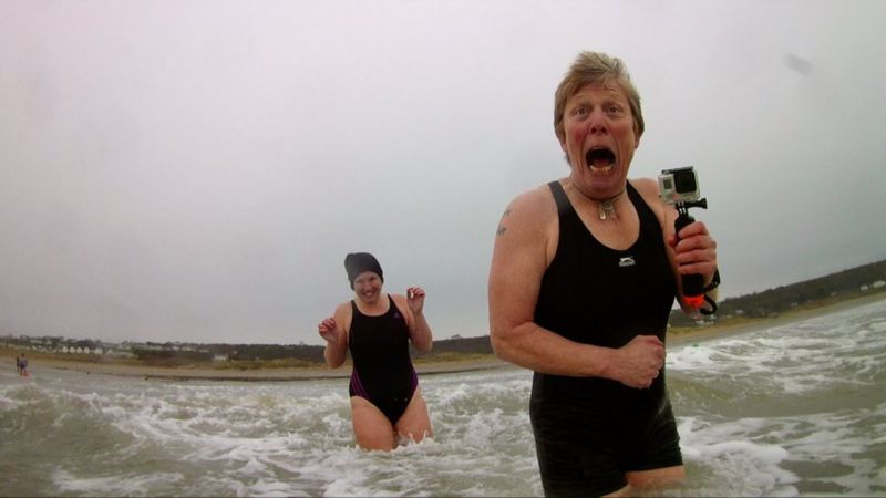 Women cold water swimming in Gower to help menopause - BBC News
