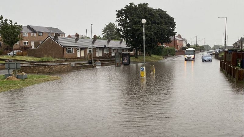 Sheffield floods: Passer-by pulls woman from partly submerged car - BBC ...