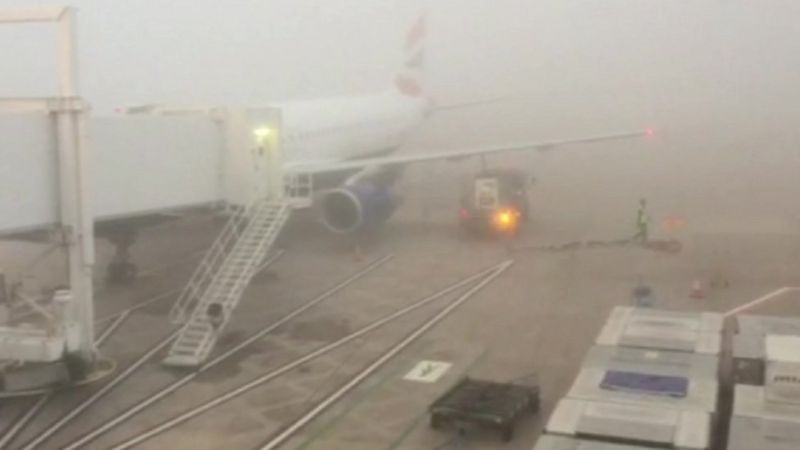 Fog causes major disruption to flights at UK airports - BBC News
