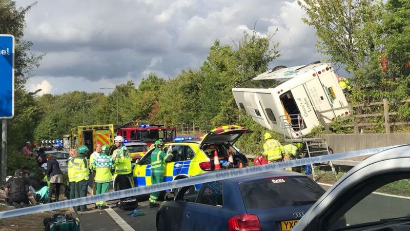 M25 coach crash: Victims remain in hospital after dozens hurt - BBC News