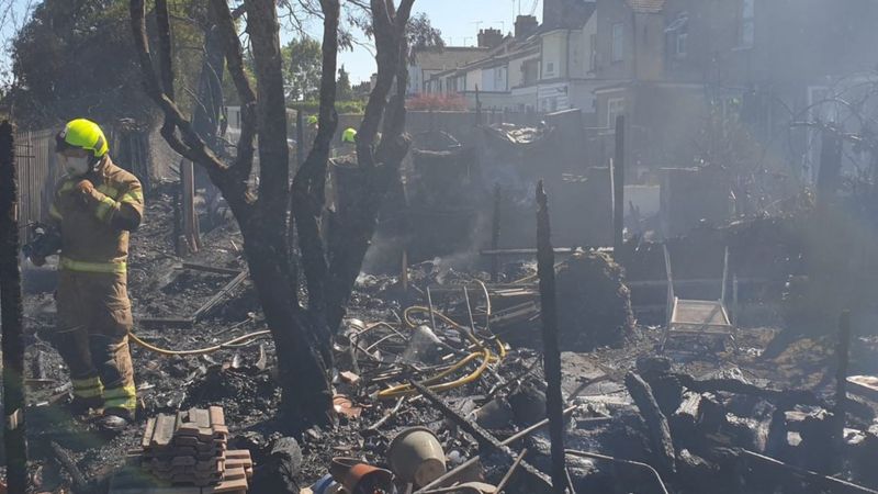 Watford embankment fire spreads to row of gardens - BBC News