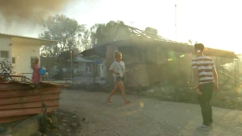 Rhodes: Cheshire tourist 'scrambles' to safety on boat as beach burns ...