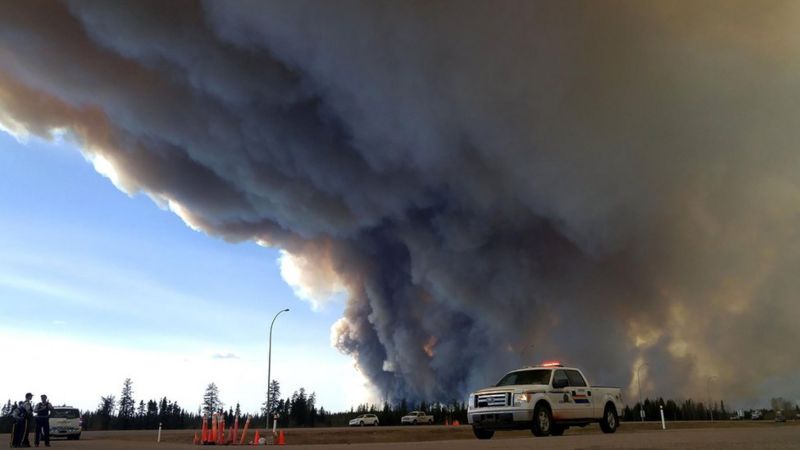 Canada wildfire advance 'slows' as evacuations finish - BBC News