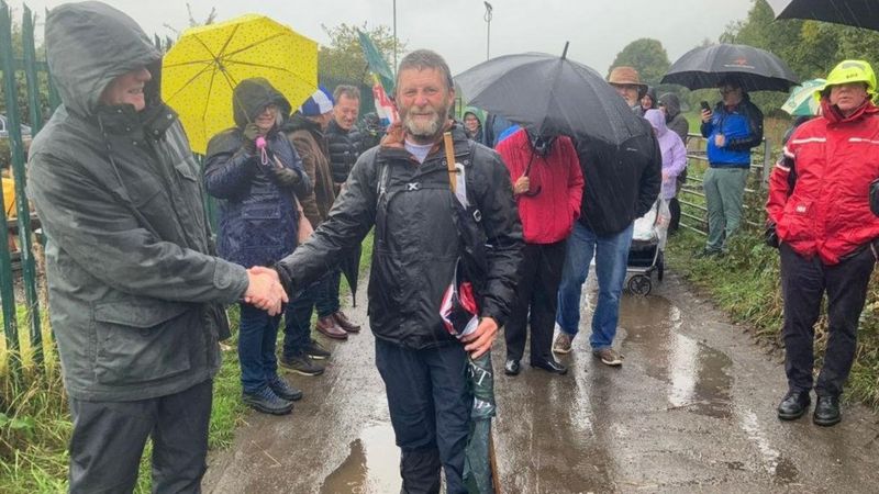 Lighthouse fan completes epic British coast walk for charity - BBC News
