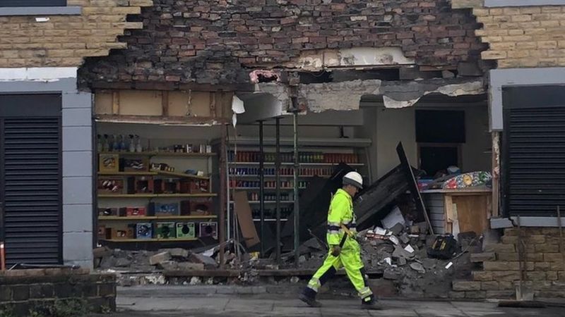Bradford home damaged as car smashes through lounge wall - BBC News