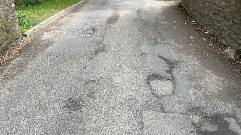Dundry Hill villagers frustrated over 'abysmal' potholes - BBC News
