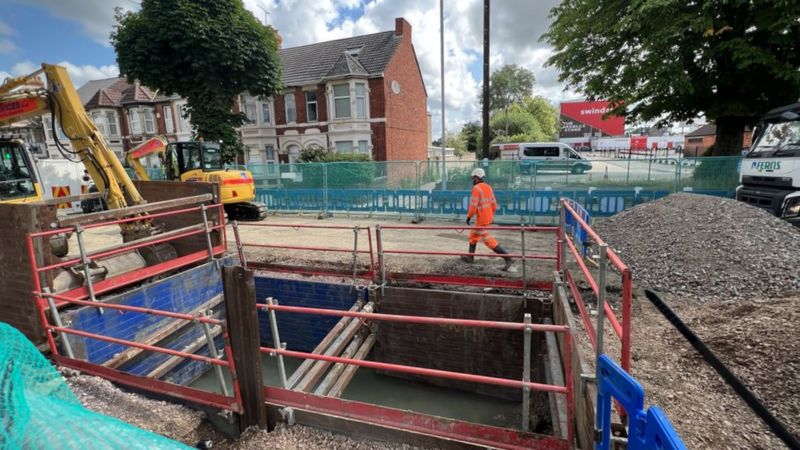 Swindon burst water main may close road for two more weeks - BBC News