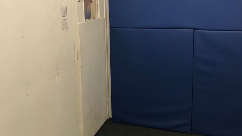 'Hundreds of pupils spend week in school isolation booths' - BBC News