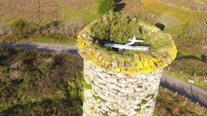 Crashed model aeroplane rescued by the navy - BBC News