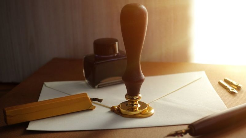 Medieval silver seal matrix found in Norfolk declared treasure - BBC News