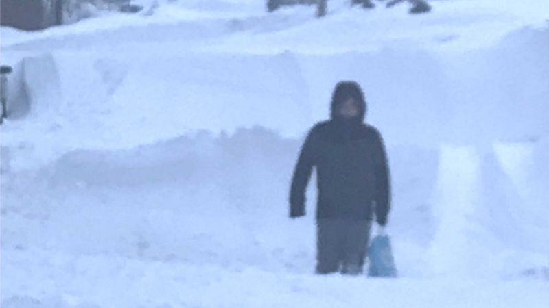 Snowed-in Cumbrian villagers forced to walk through 12ft snowdrifts for ...