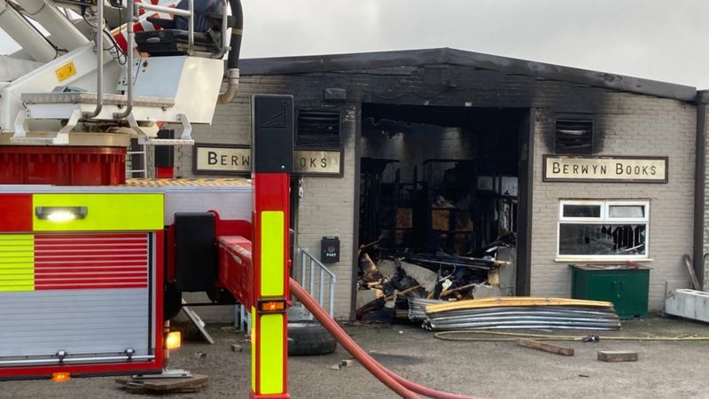 Buckley fire: Major blaze at antique book firm Berwyn Books - BBC News