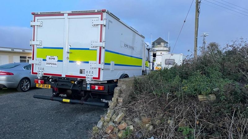 Pakefield caravans evacuated as cliff fall reveals suspected bomb - BBC ...