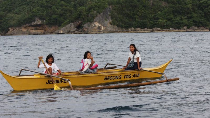 Getting boats to children who have to swim to school - BBC News