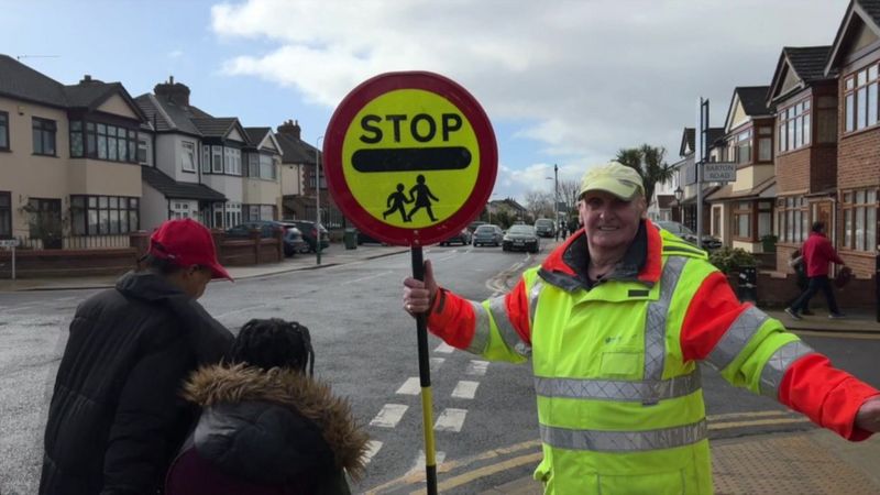 Havering lollipop man, 93, made redundant from crossing job - BBC News