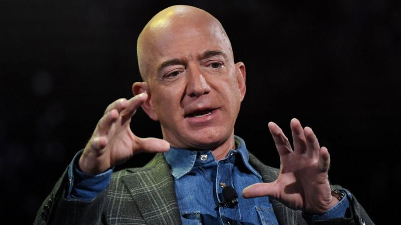 Protester confronts Jeff Bezos on stage - BBC News