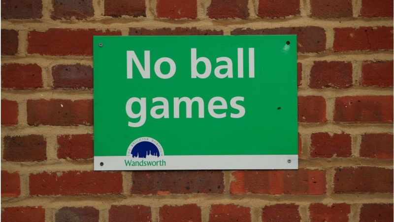 London charity wants 'No Ball Games' signs removed - BBC News