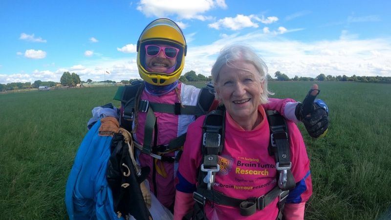 Stone woman with fear of heights does charity skydive - BBC News