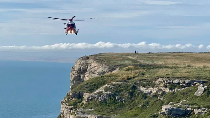 Climber rescued after falling seven metres from Portland cliffs - BBC News