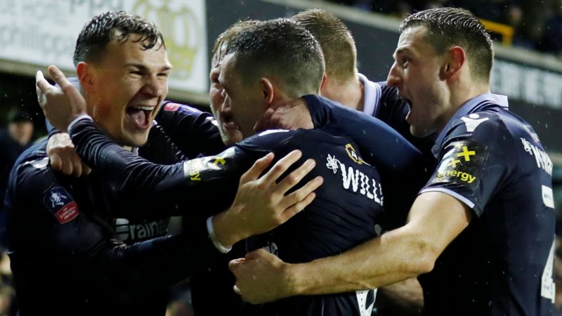 Millwall v Everton: Man slashed in face during football brawl - BBC News