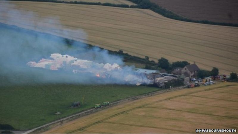 Pilot spots Dorset farm fire from the air - BBC News