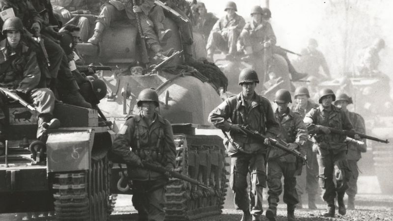 Band of Brothers actors to parachute into Normandy for D-Day - BBC News