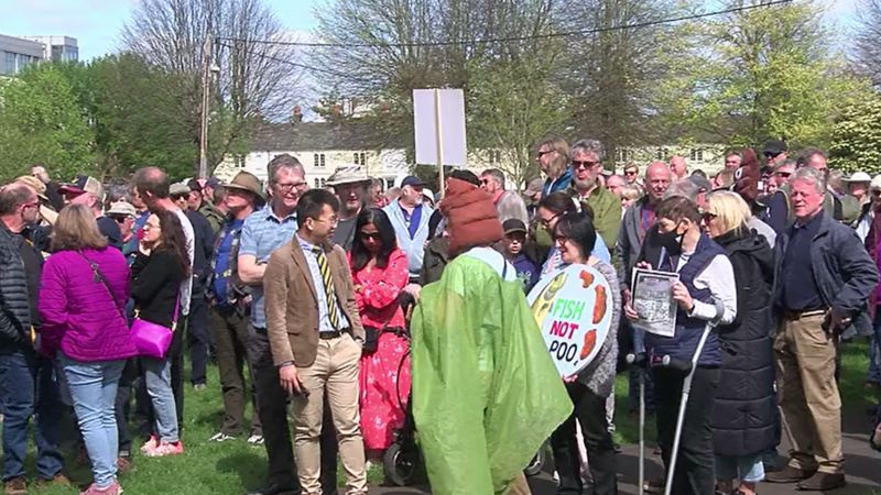 Dozens join protest against sewage discharges into rivers - BBC News