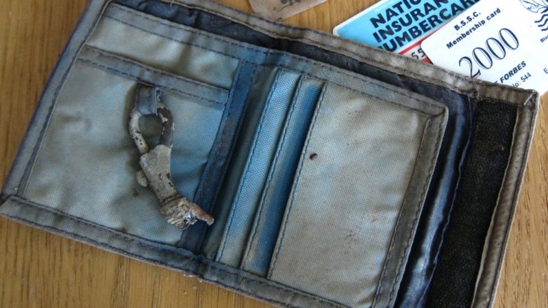 Lost wallet found behind train seat after 30 years - BBC News