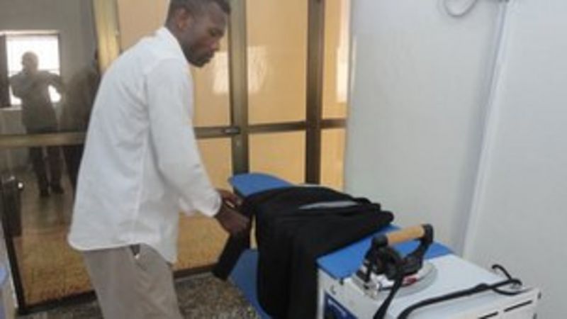 Somali opens Mogadishu's first dry cleaners in decades - BBC News